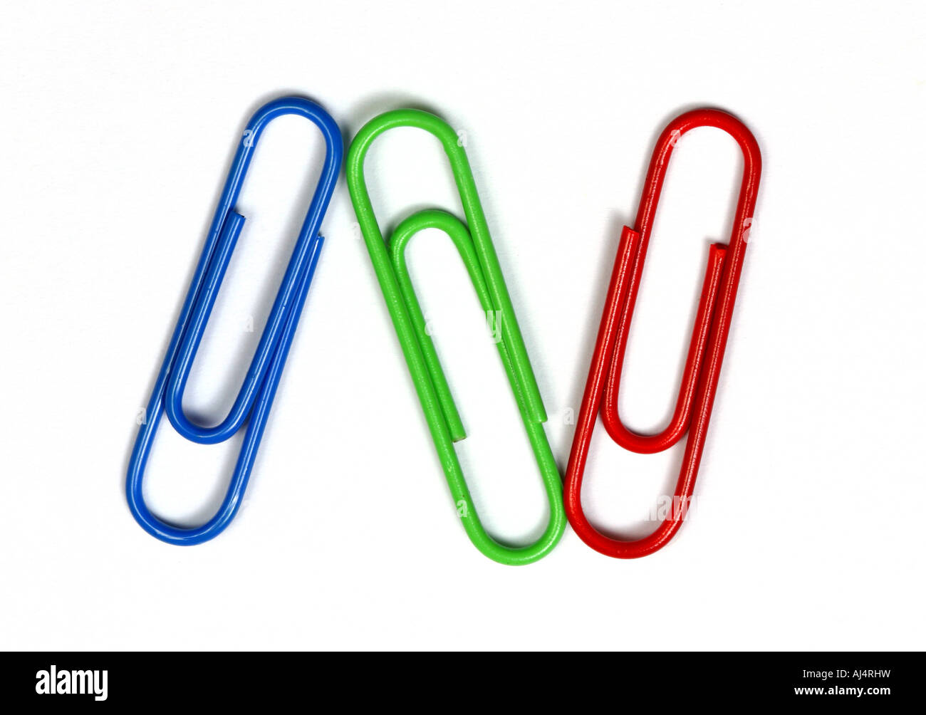 Colored clips over a white background Stock Photo - Alamy