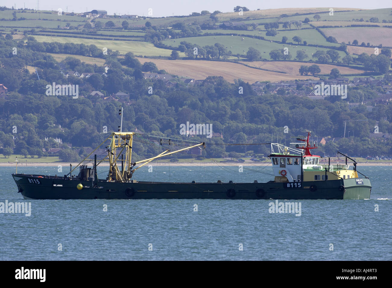 large mussel fishing boat trawling dregding for mussels at sea off ...