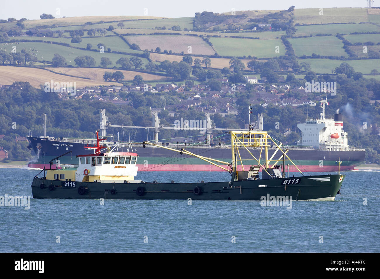 nord voyager bulk carrier ship passes large mussel fishing boat ...