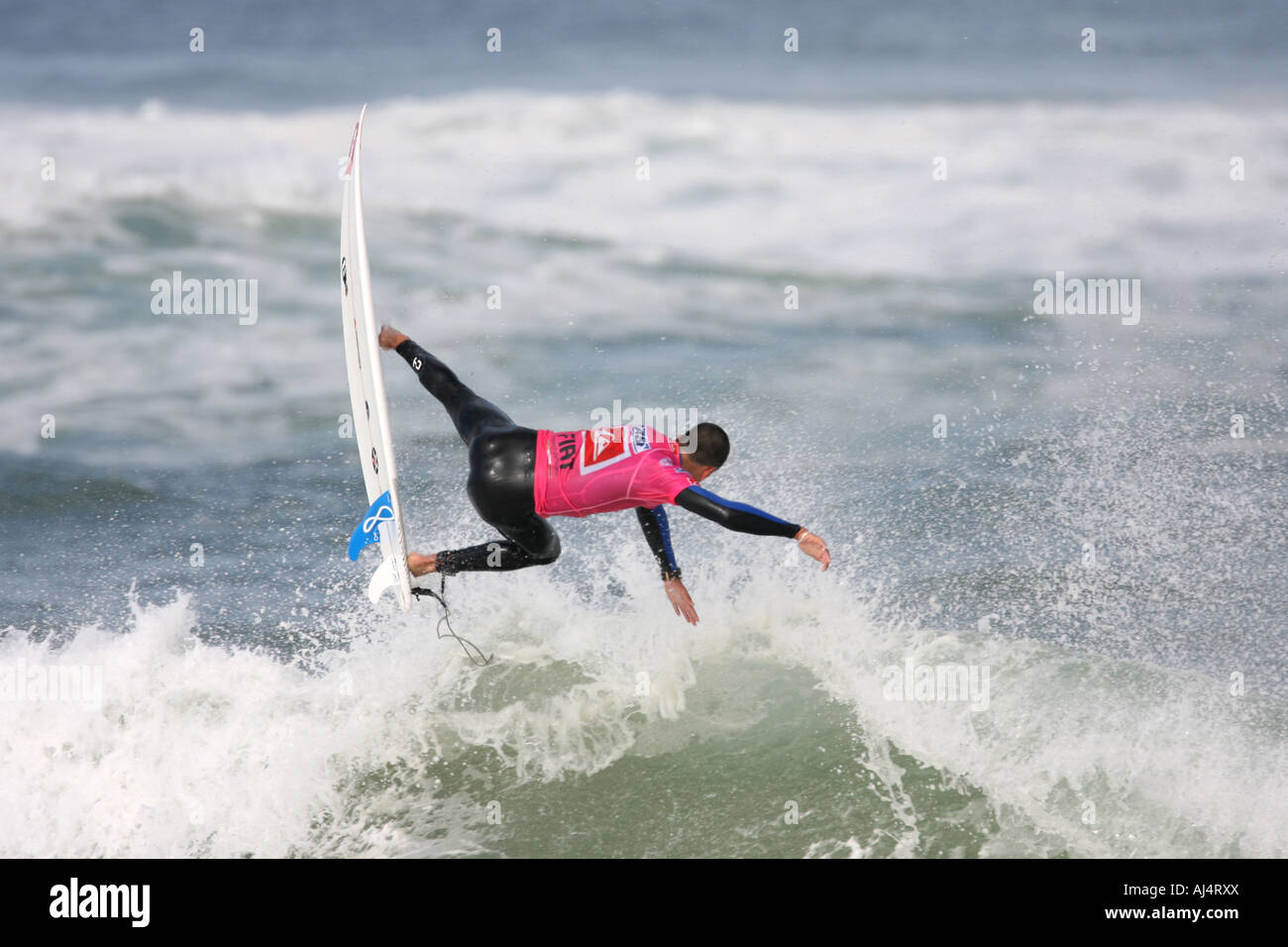 A Surfer performs an aerial on a Wave Stock Photo - Alamy