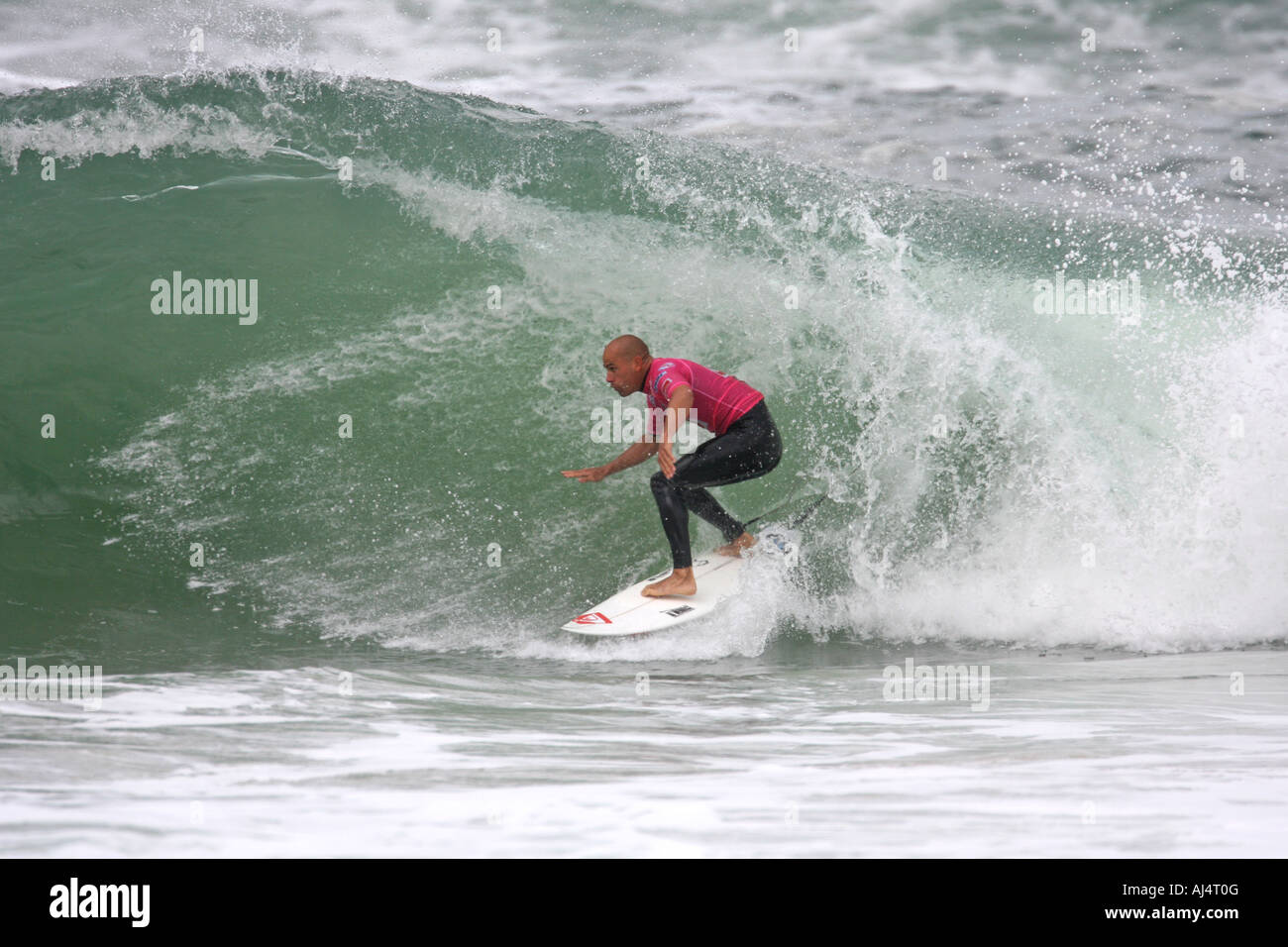 A Surfer rides a Wave Stock Photo - Alamy