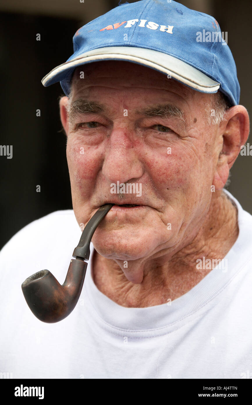 Trawler fishing boat old fisherman with pipe in Fish Market harbour ...