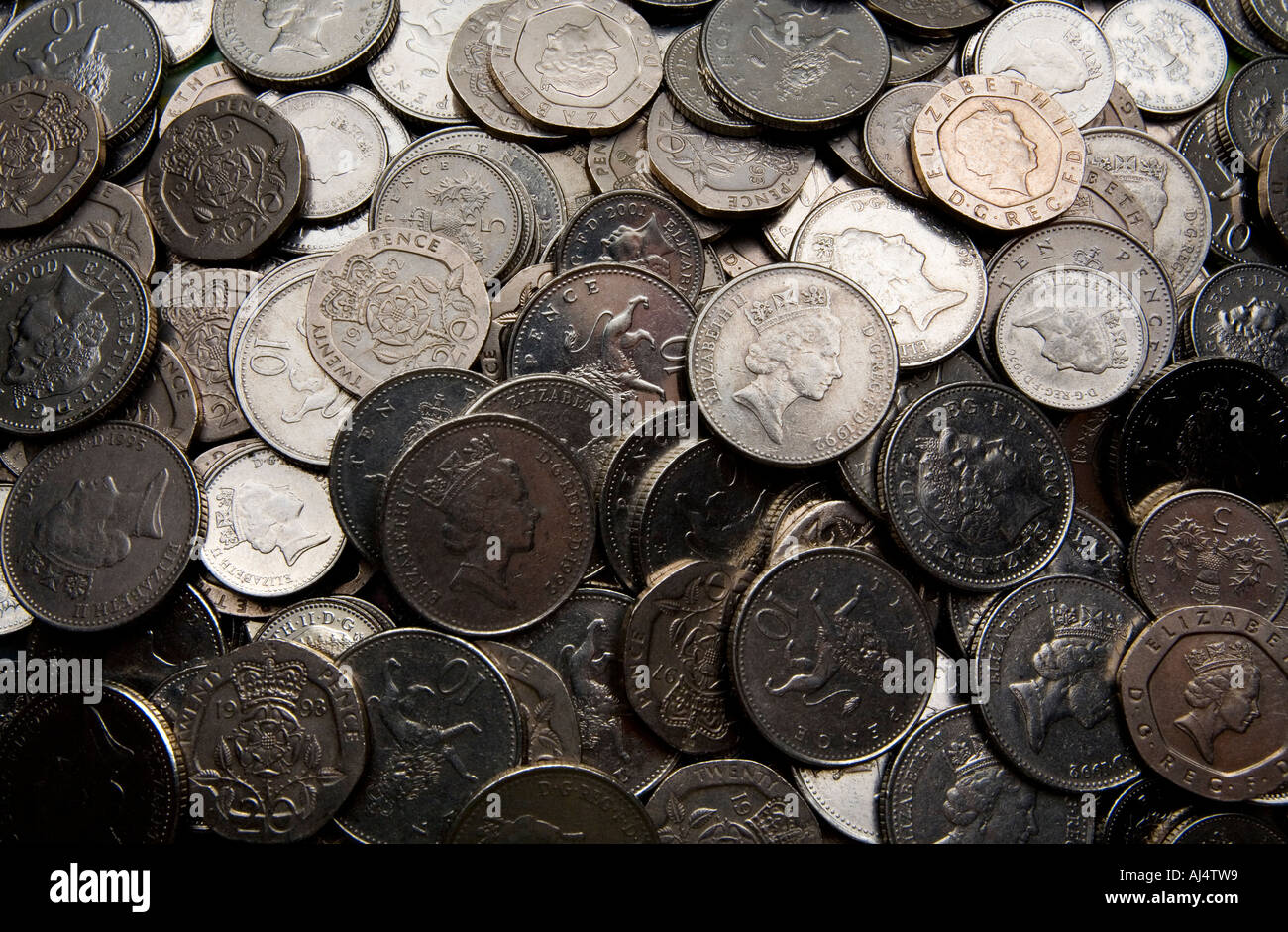 Silver coins in the Great British Pound currency Stock Photo - Alamy