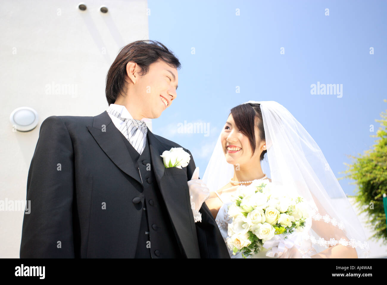Bride and groom looking at each other Stock Photo - Alamy