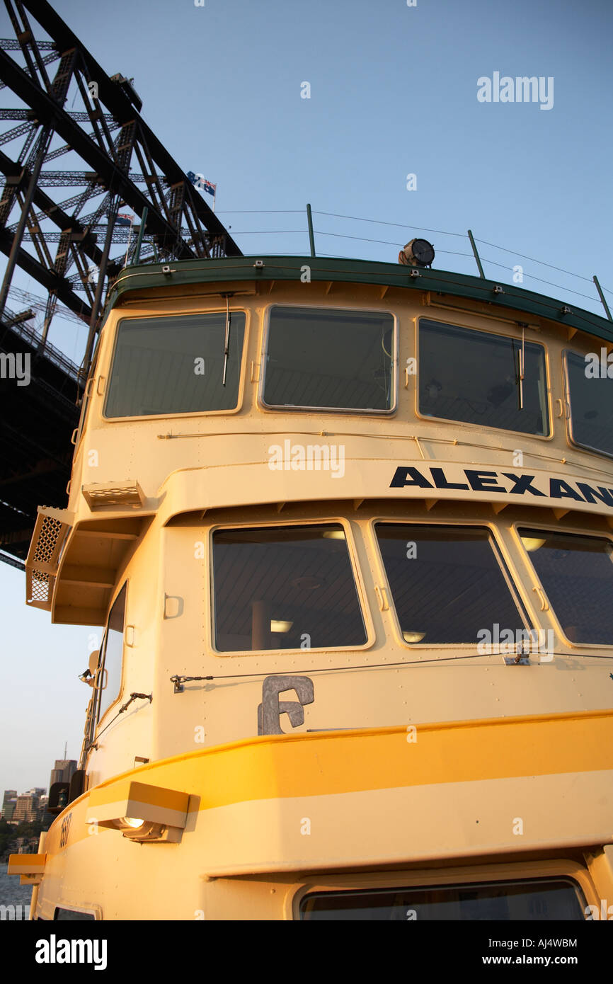 Harbour Bridge beyond ferry in warm evening light Sydney New South ...