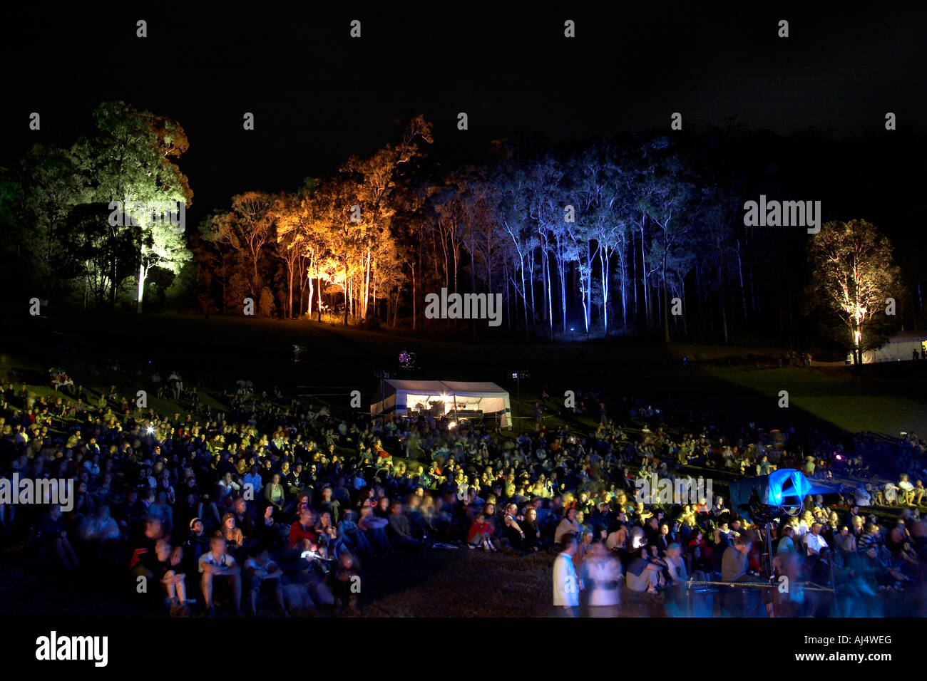 Trees around stage night lit by coloured lights by Walter Holt and ...