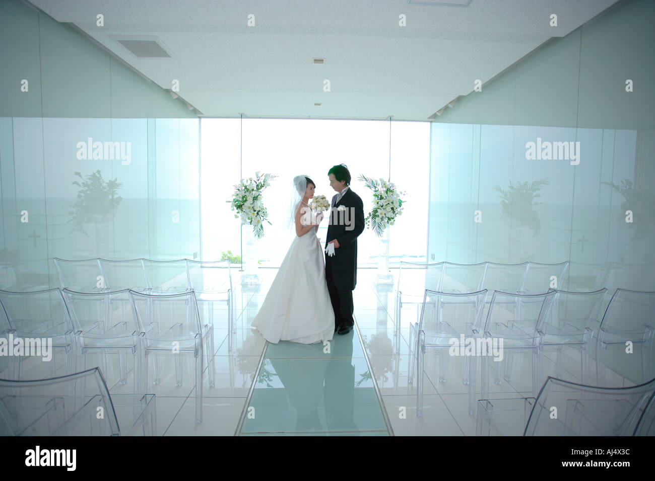 Bride and groom at altar Stock Photo - Alamy
