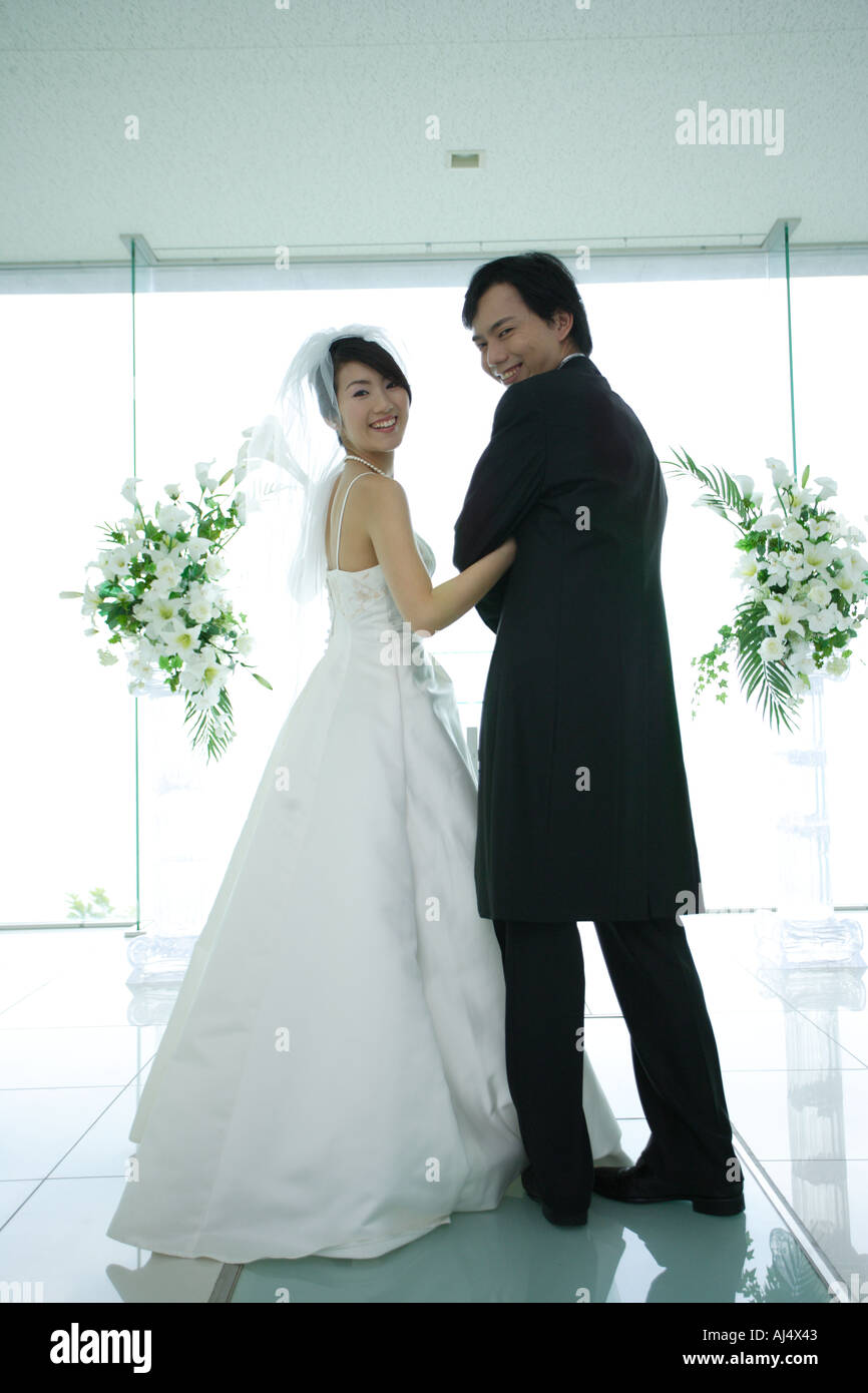 Bride and groom at altar Stock Photo - Alamy