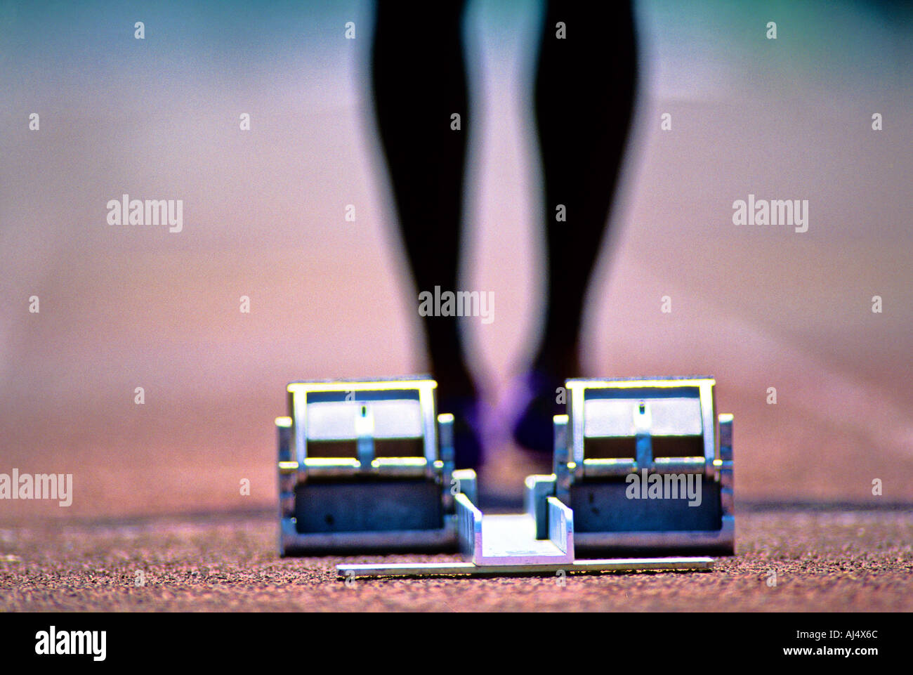 Sprinter getting set in the starting blocks Stock Photo - Alamy