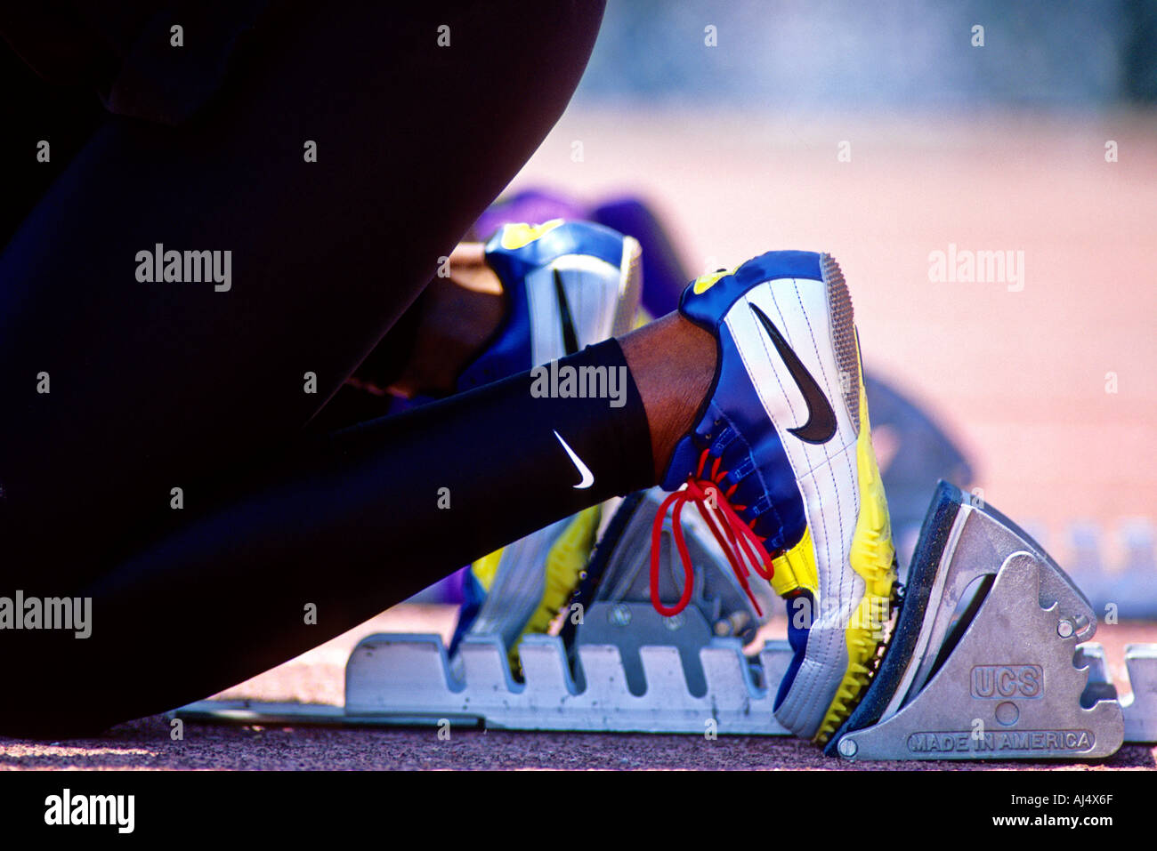 Sprinter getting set in the starting blocks Stock Photo - Alamy