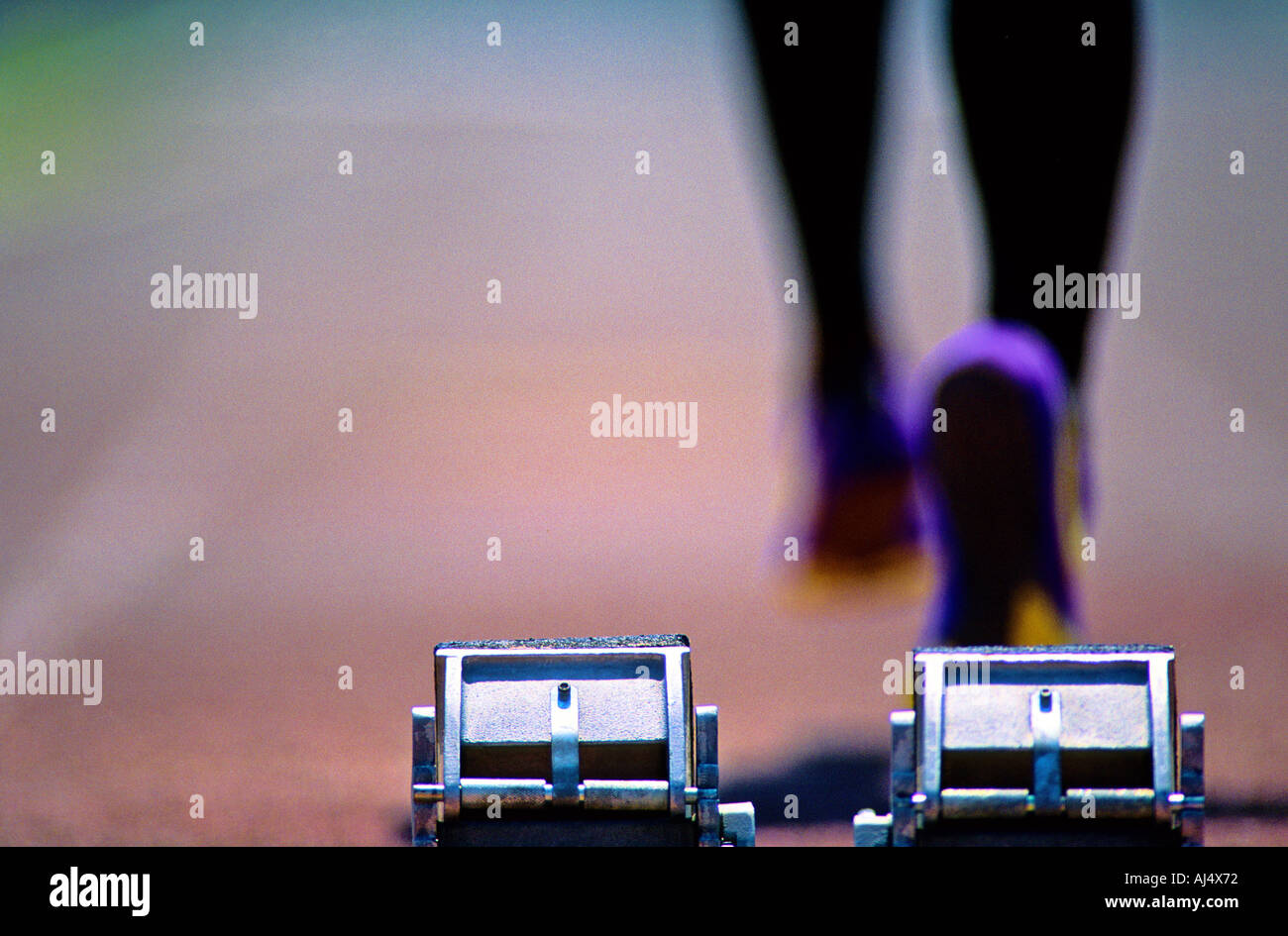 Sprinter getting set in the starting blocks Stock Photo - Alamy