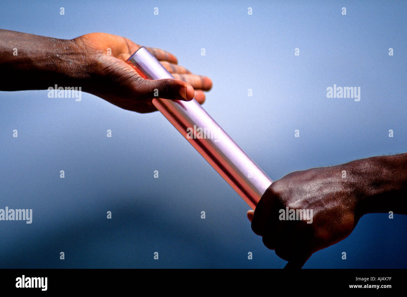 Passing the baton Stock Photo - Alamy
