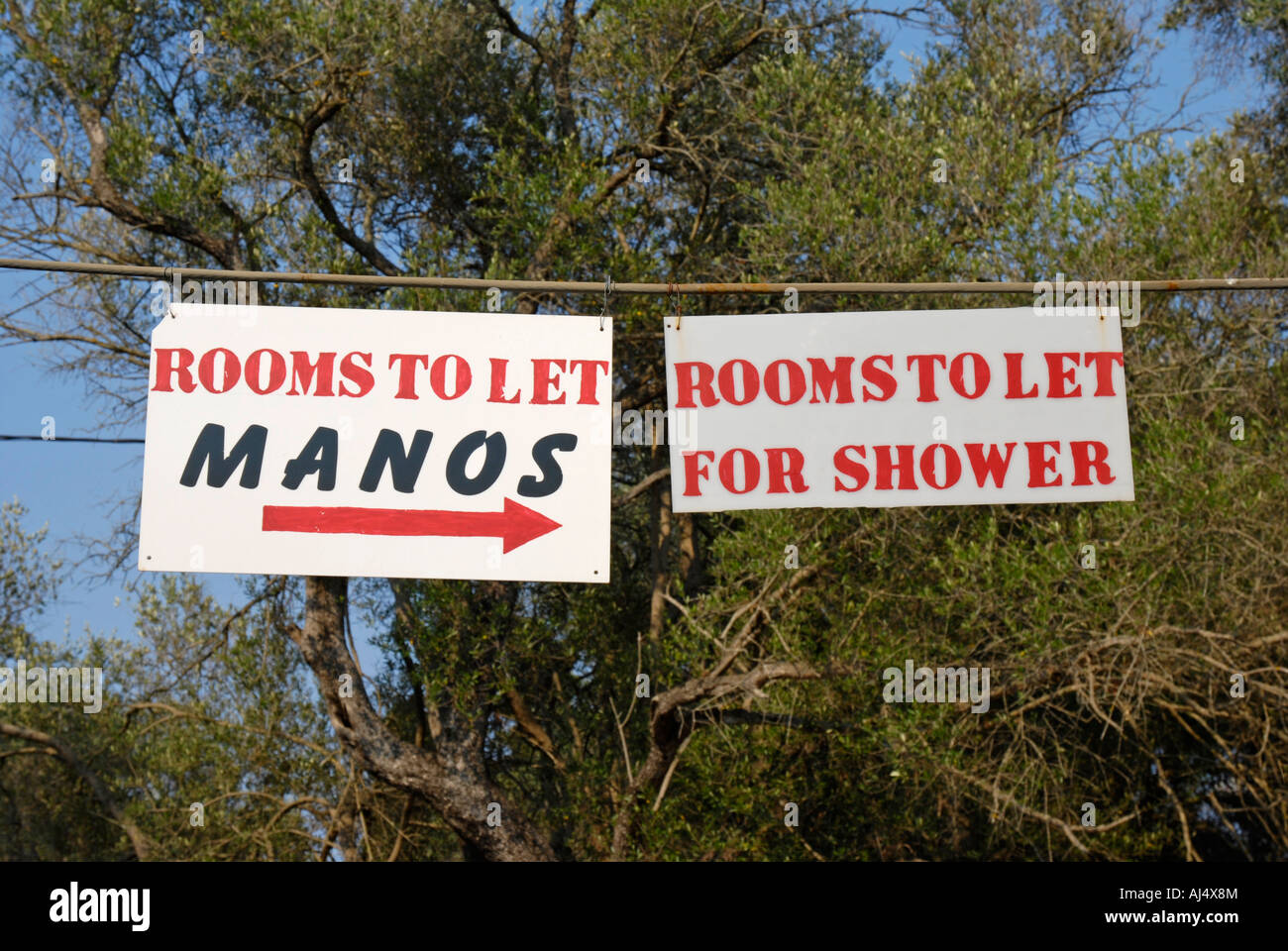 rooms to let sign boards in Kavos Corfu Island Greece Stock Photo - Alamy