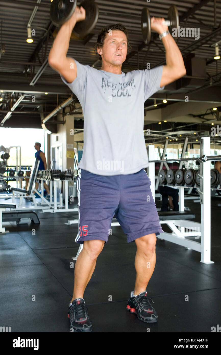 Fit male exercising in a gym Workout Stock Photo - Alamy