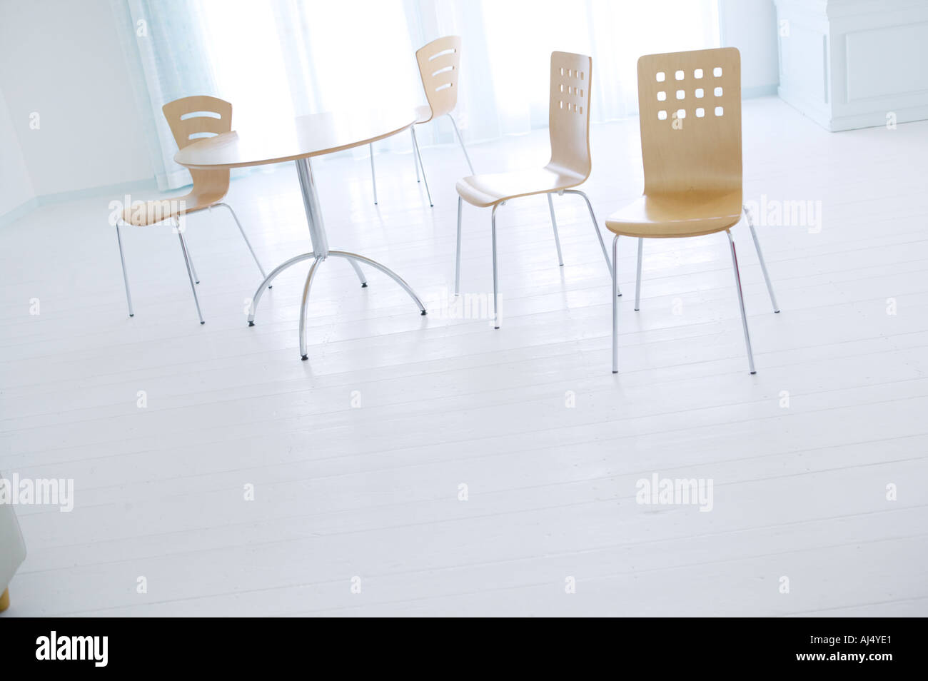 Table and four chairs Stock Photo - Alamy