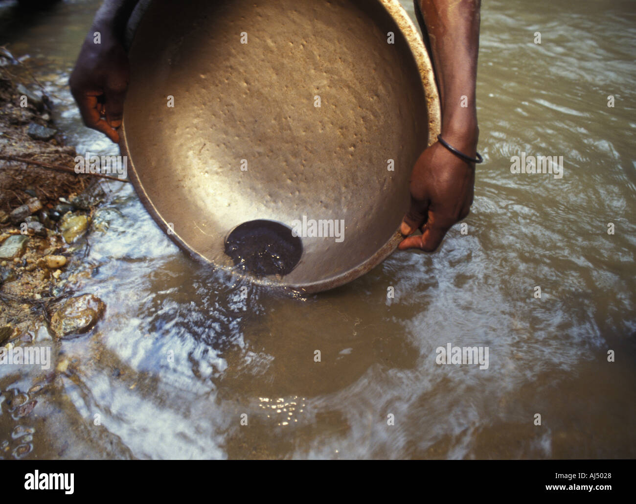 Gold panners hand panning for gold in Kakamega Forest Kenya Stock Photo ...