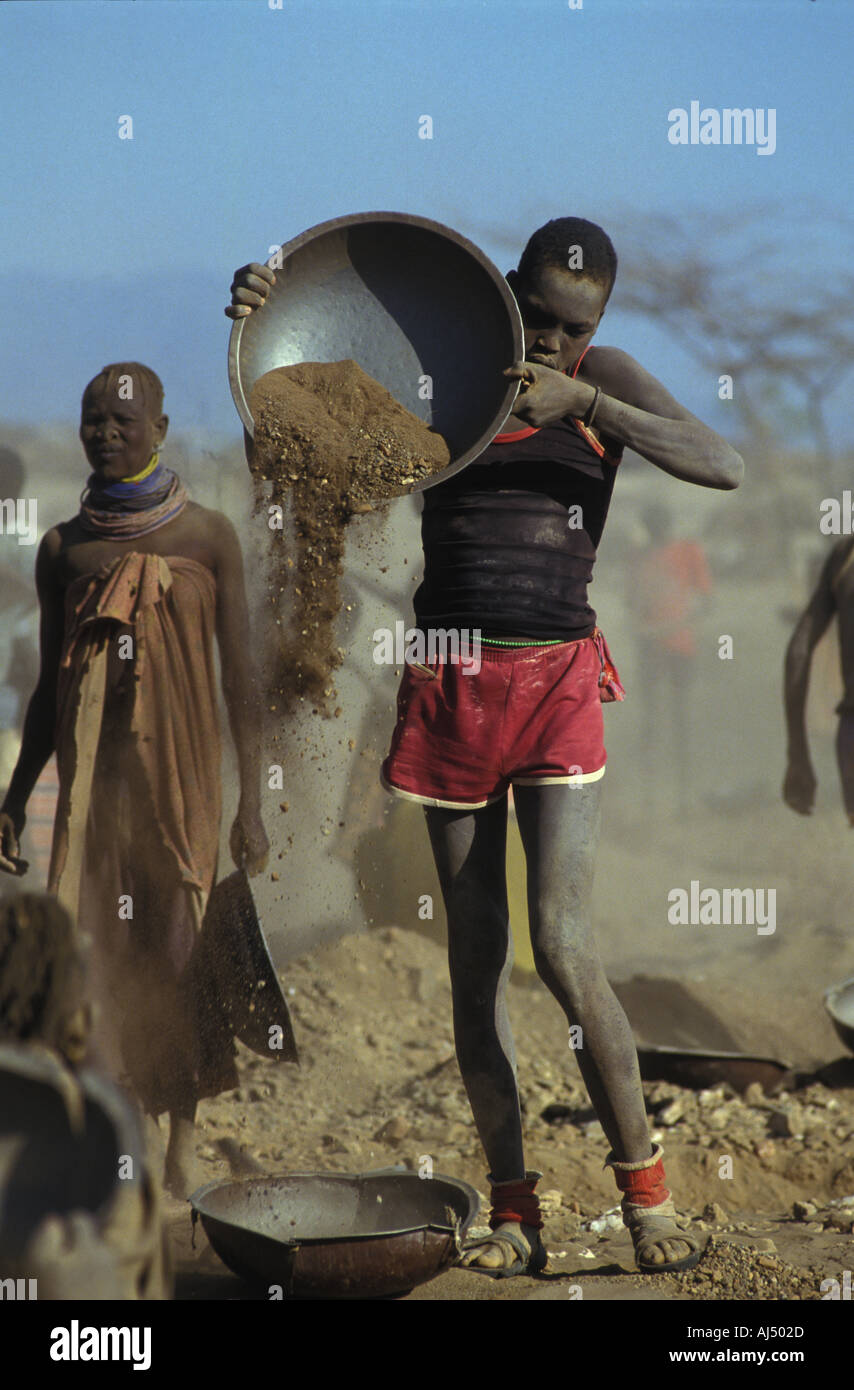 Gold panners dry hand panning for gold in Turkana Kenya Stock Photo - Alamy