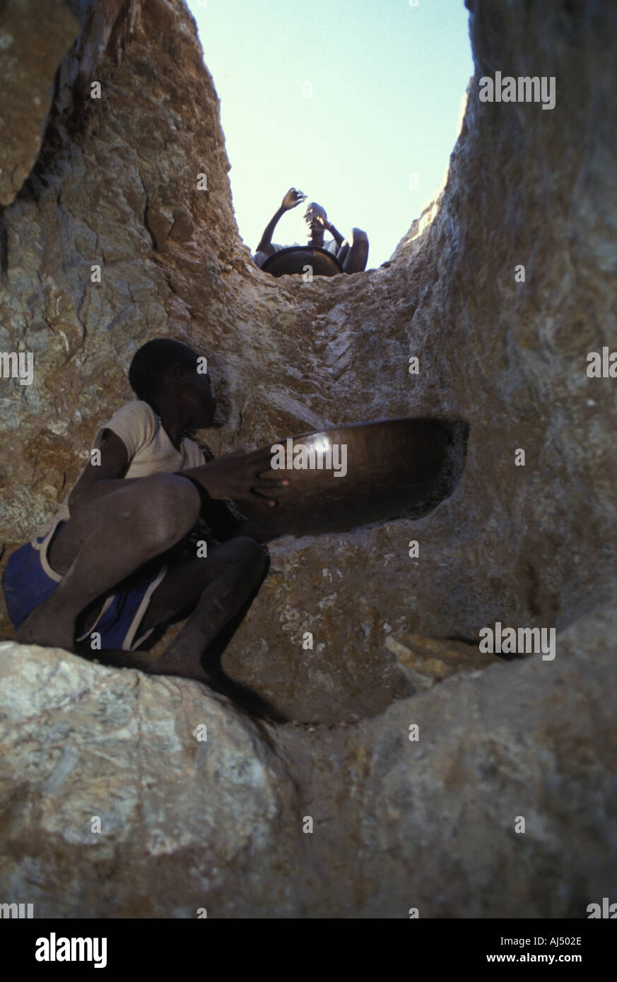 Gold panners dry hand panning for gold in Turkana Kenya Stock Photo - Alamy