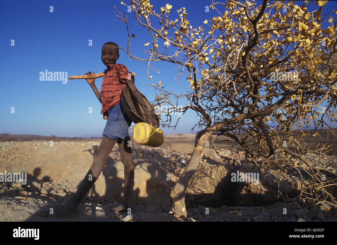 A child gold panner dry hand panning for gold in Turkana Kenya Stock ...