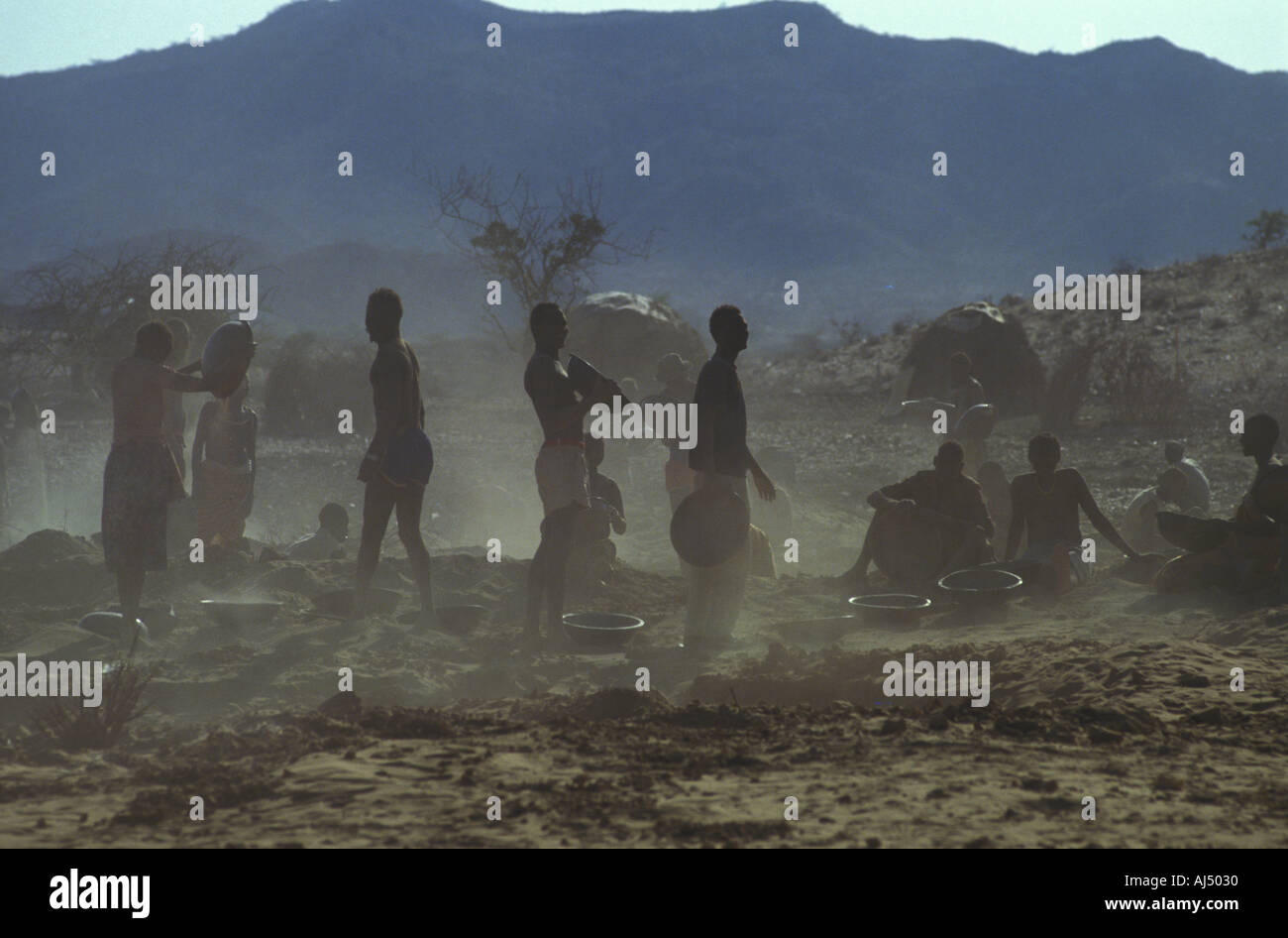 Gold panners dry hand panning for gold in Turkana Kenya Stock Photo - Alamy