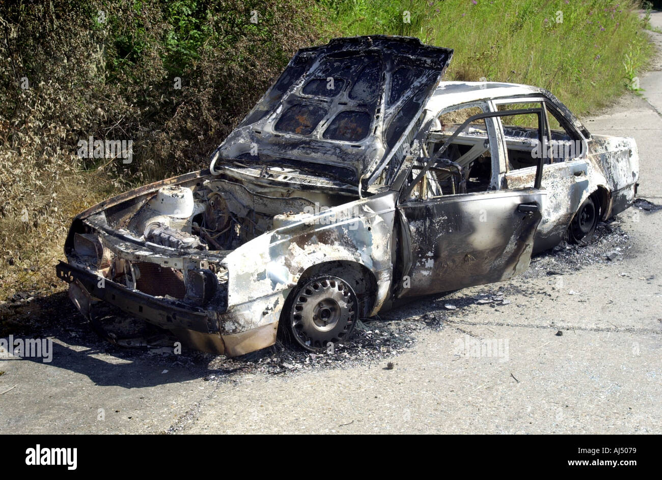 Burnt out car in a quarry at Sundon near Luton Bedfordshire UK Stock ...