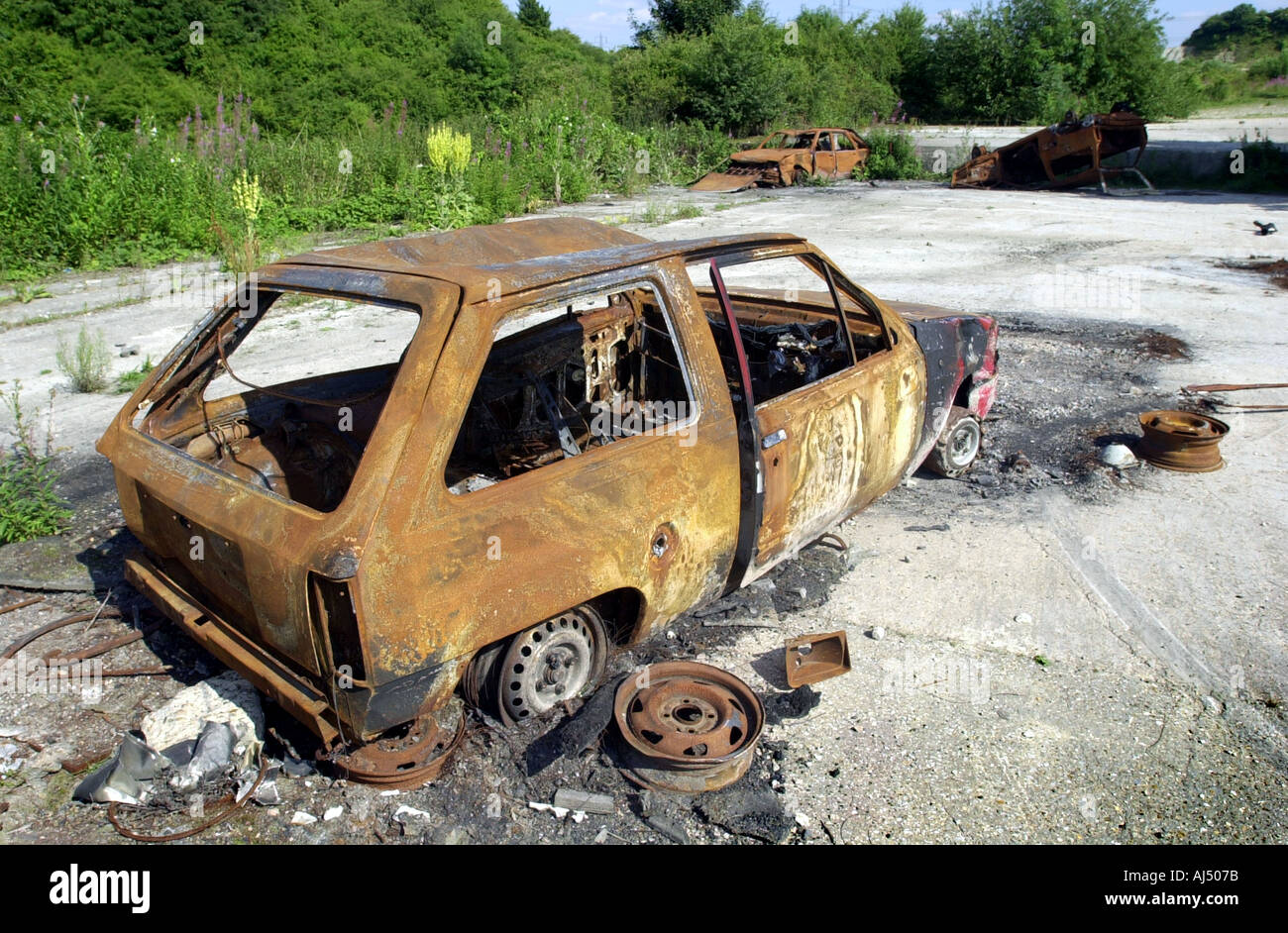 Burnt out cars in a quarry at Sundon near Luton Bedfordshire UK Stock ...