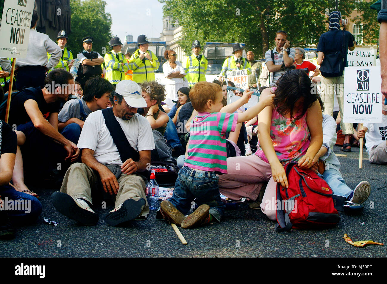 Families with children stage a sit down protest outside Downing Street ...