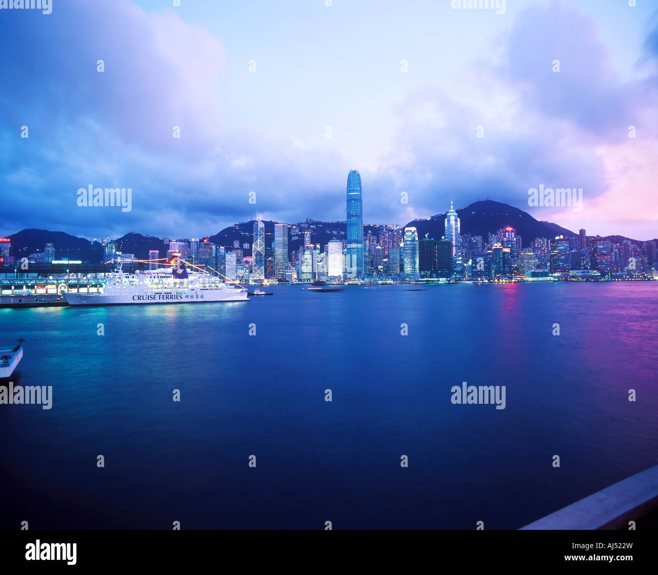 Ocean liner cruising Victoria Harbour with Hong Kong Island skyline at ...