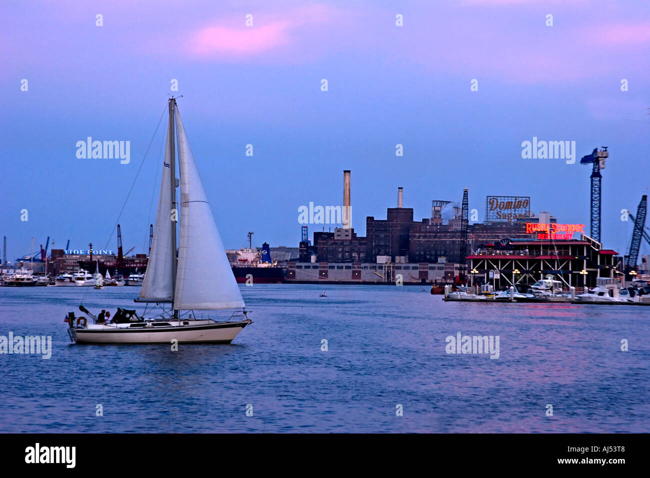 Sailboat in Baltimore's Inner Harbor at dusk Stock Photo - Alamy