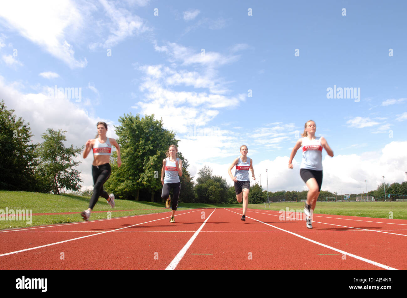 Athletics group running Stock Photo - Alamy