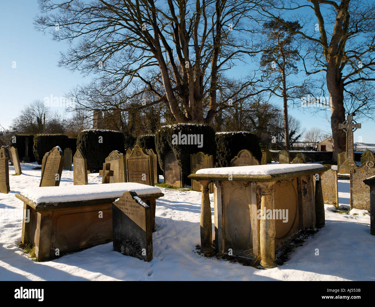 Graveyard with old tombs in village of Slingsby in North Yorkshire ...