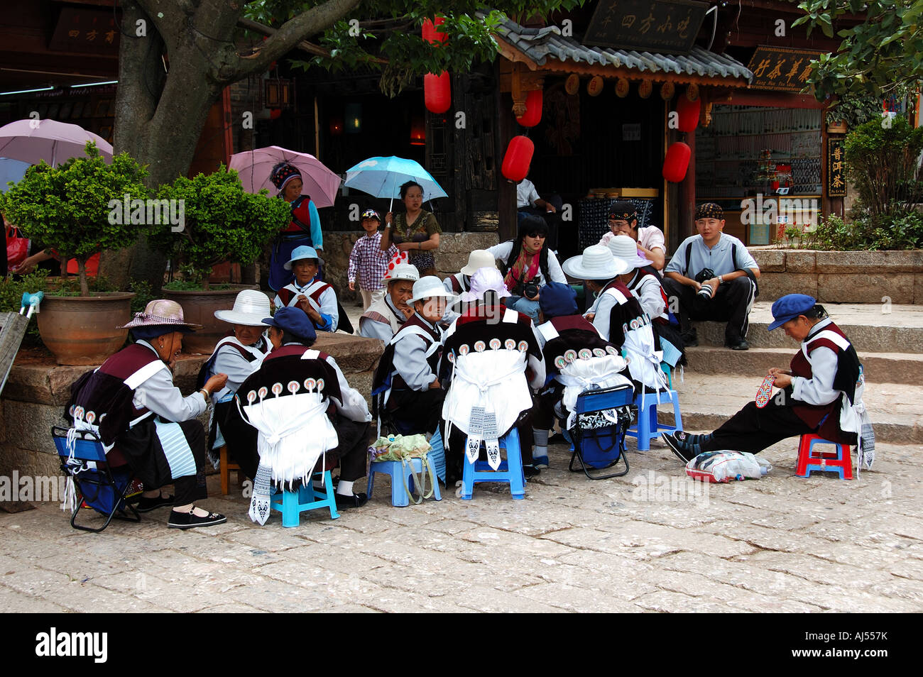 Local folks sitting by the city square in Lijiang, Yunnan, China Stock ...