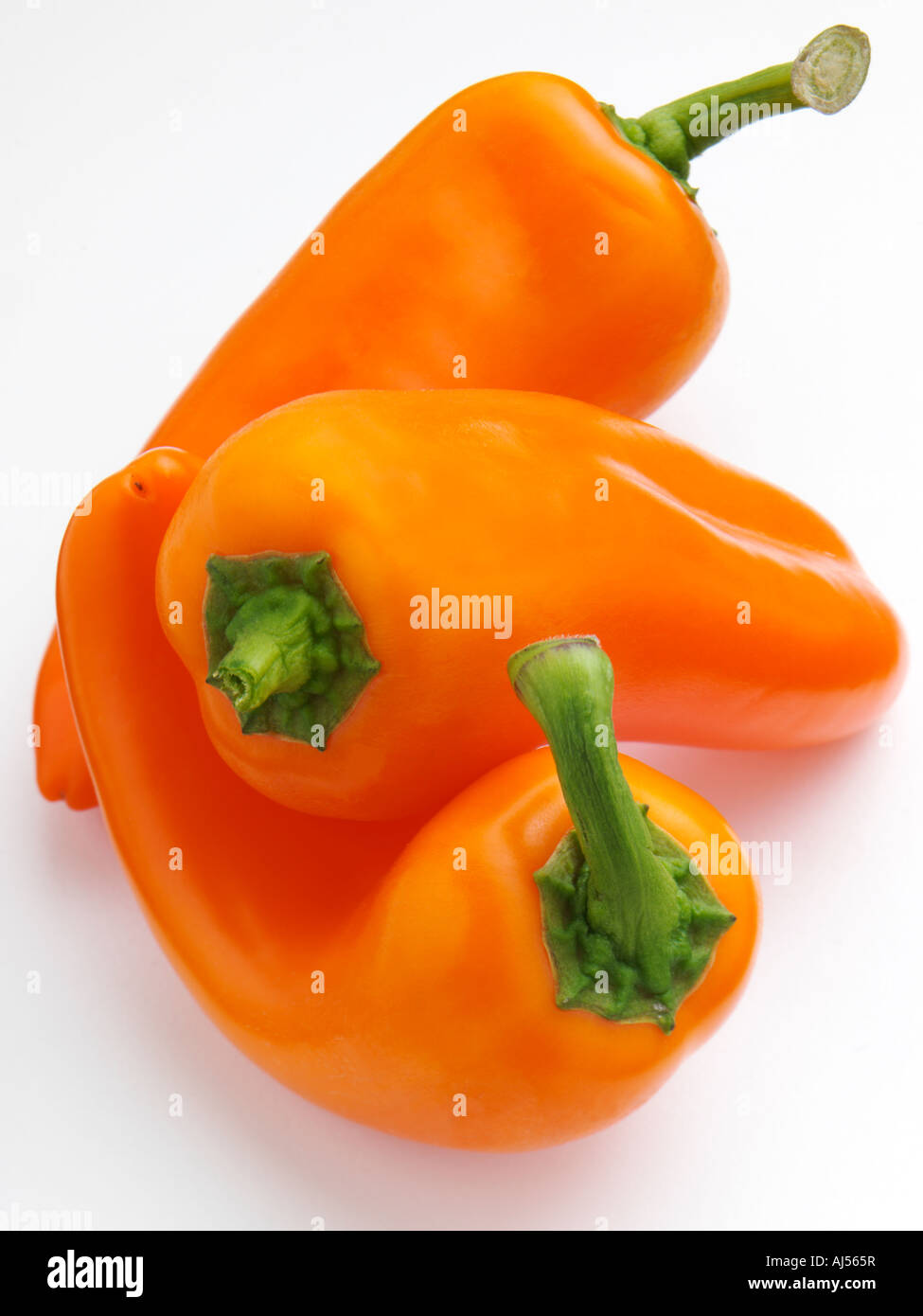 Orange sweet peppers on a white background Stock Photo - Alamy