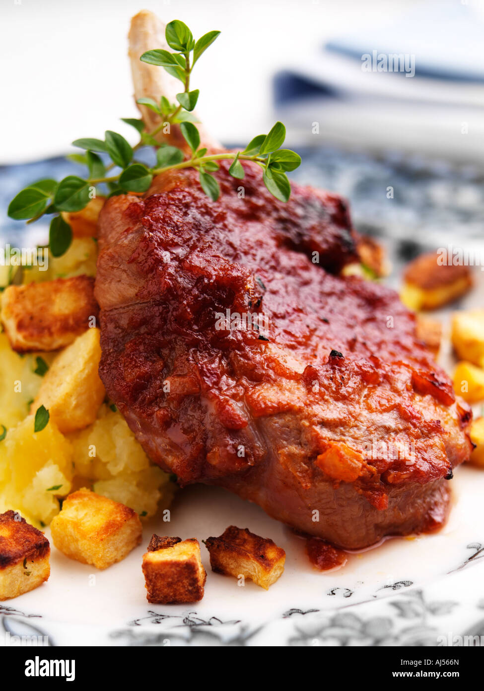 A pork chop with sauteed potatoes and mashed swede Stock Photo - Alamy