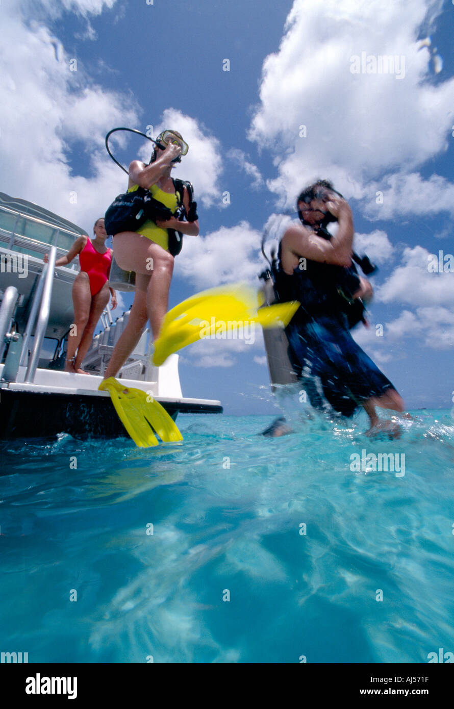 Divers doing giant stride entry off boat Stock Photo - Alamy