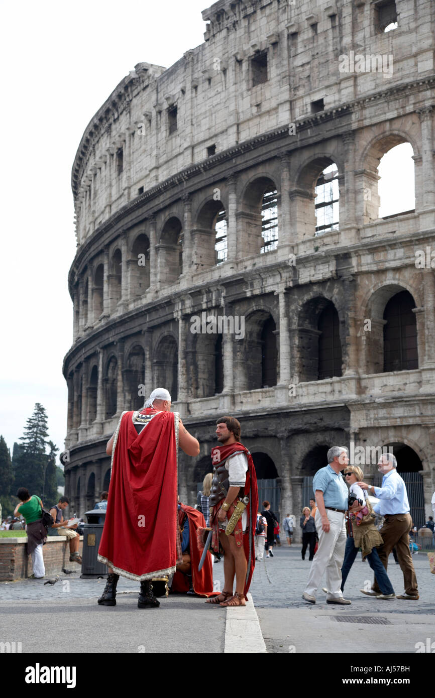 Imitation gladiators stand outside the Colosseum to get photographs ...