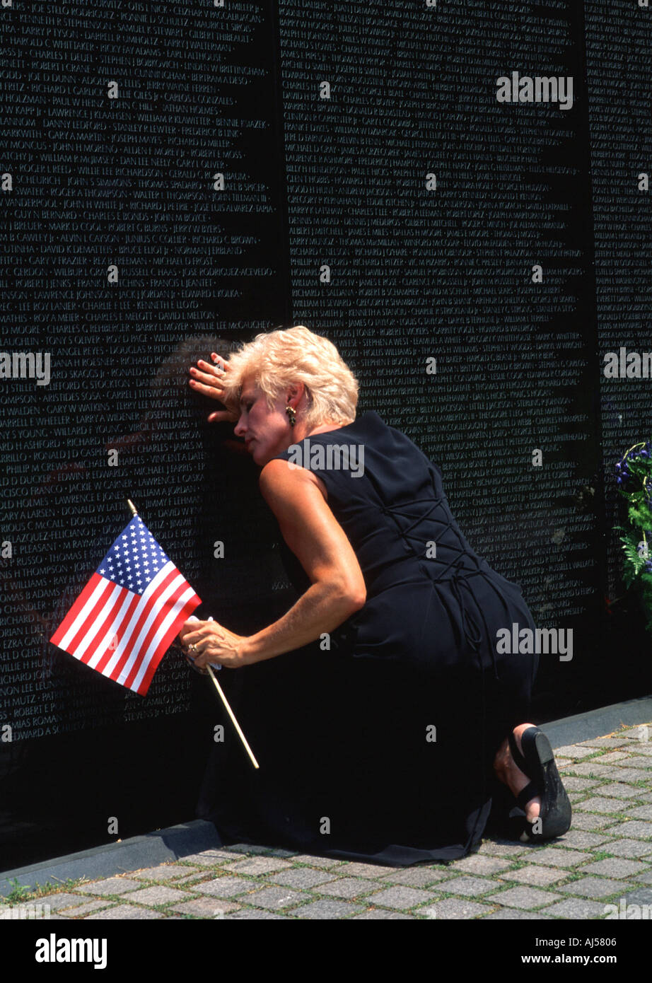Woman remembering loved one at Vietnam Memorial Washington D C Stock ...