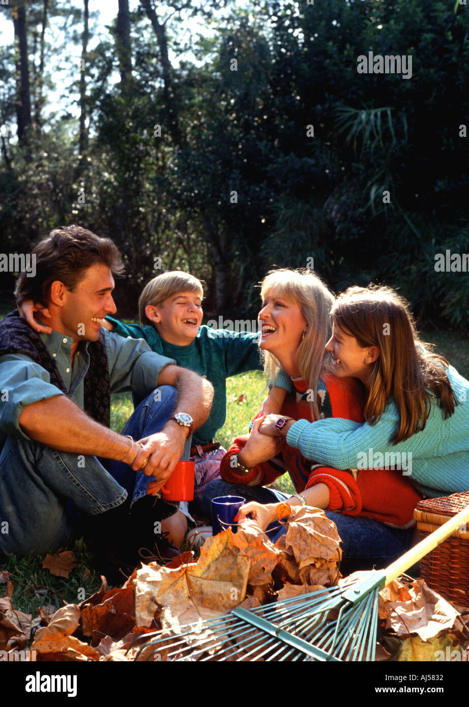 Raking leaves family hi-res stock photography and images - Alamy