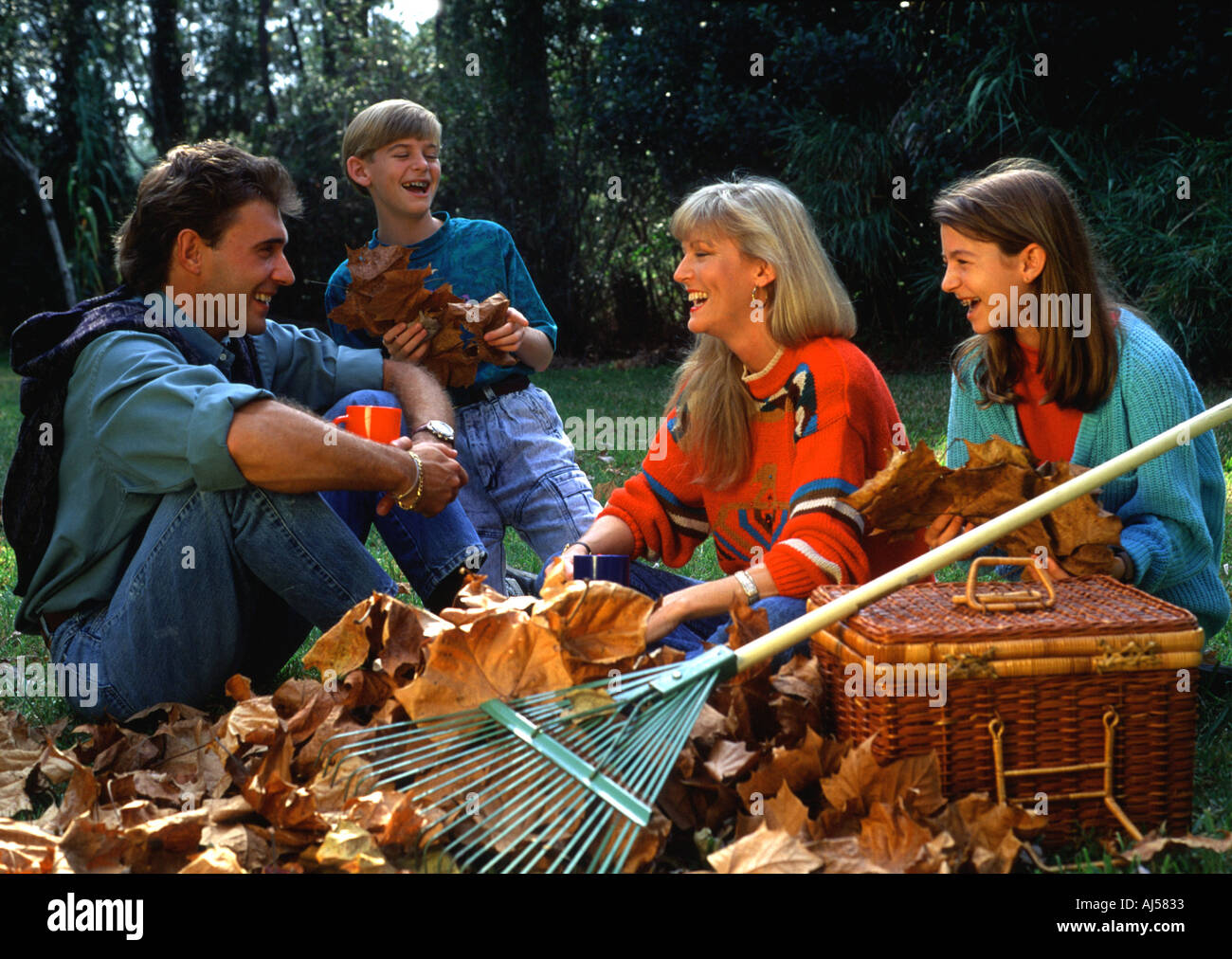 Raking leaves family hi-res stock photography and images - Alamy