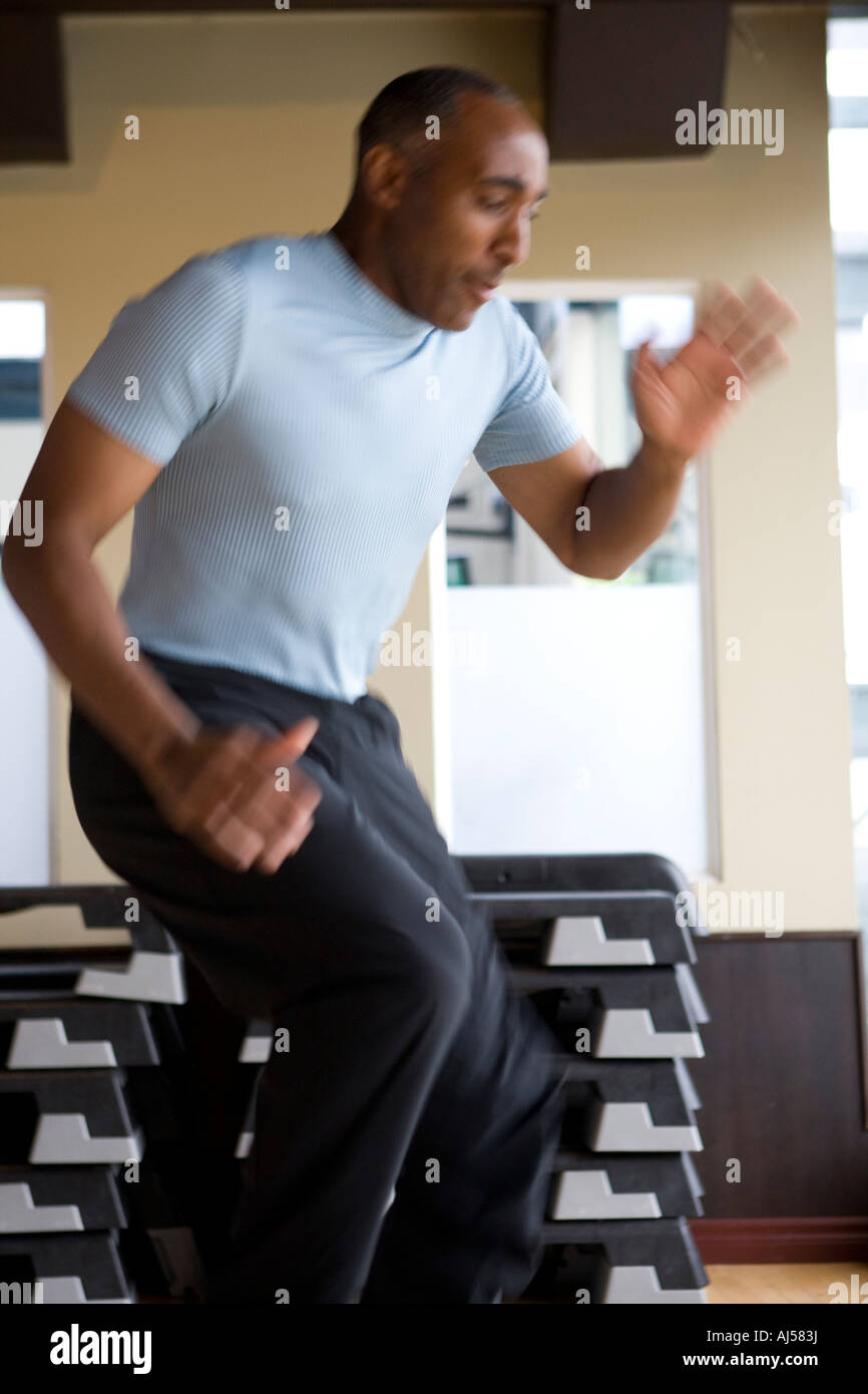 fit fitness male girl exercising in a gym jump step workout Stock Photo ...