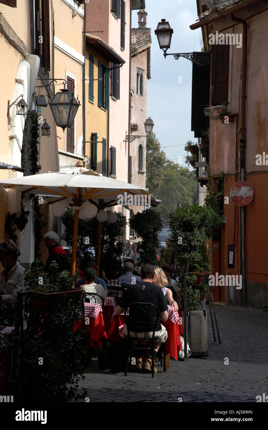 Street cafe restaurant in Narrow street of Trastevere Rome Lazio Italy ...