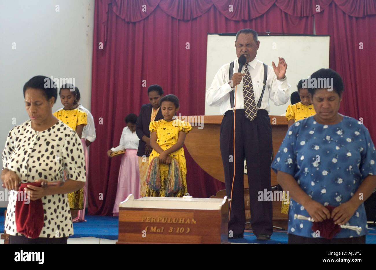 A pastor doing his dominical sermon in a Christian Church in Jayapura ...