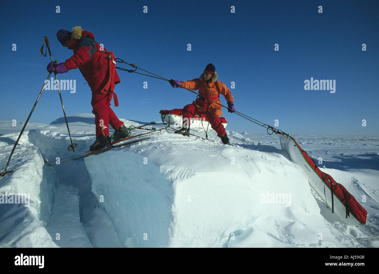 Royal Marines hauling their sleds over sea rubble in the Arctic in 55 ...
