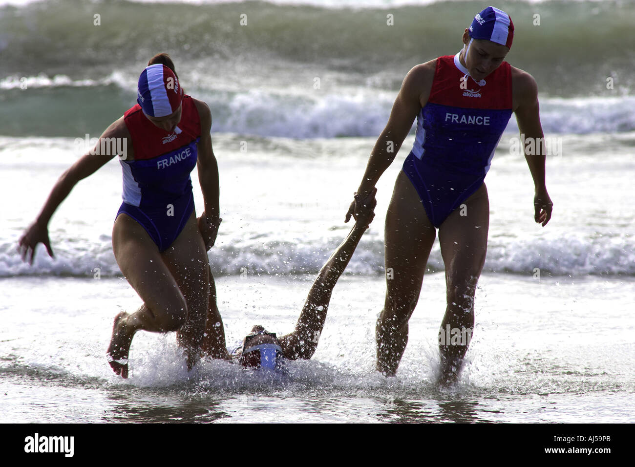 French lifesavers pull person to safety Stock Photo - Alamy