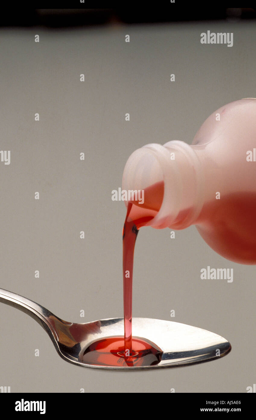 Science medical cold medicine being poured into a spoon hi-res stock ...