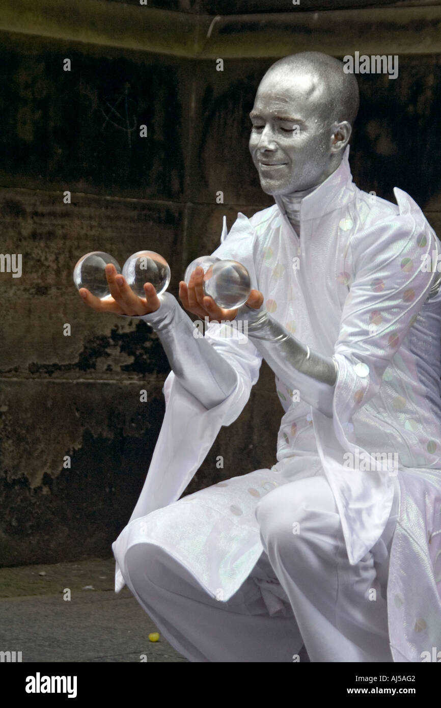 Silver painted street performer entertainer hi-res stock photography ...