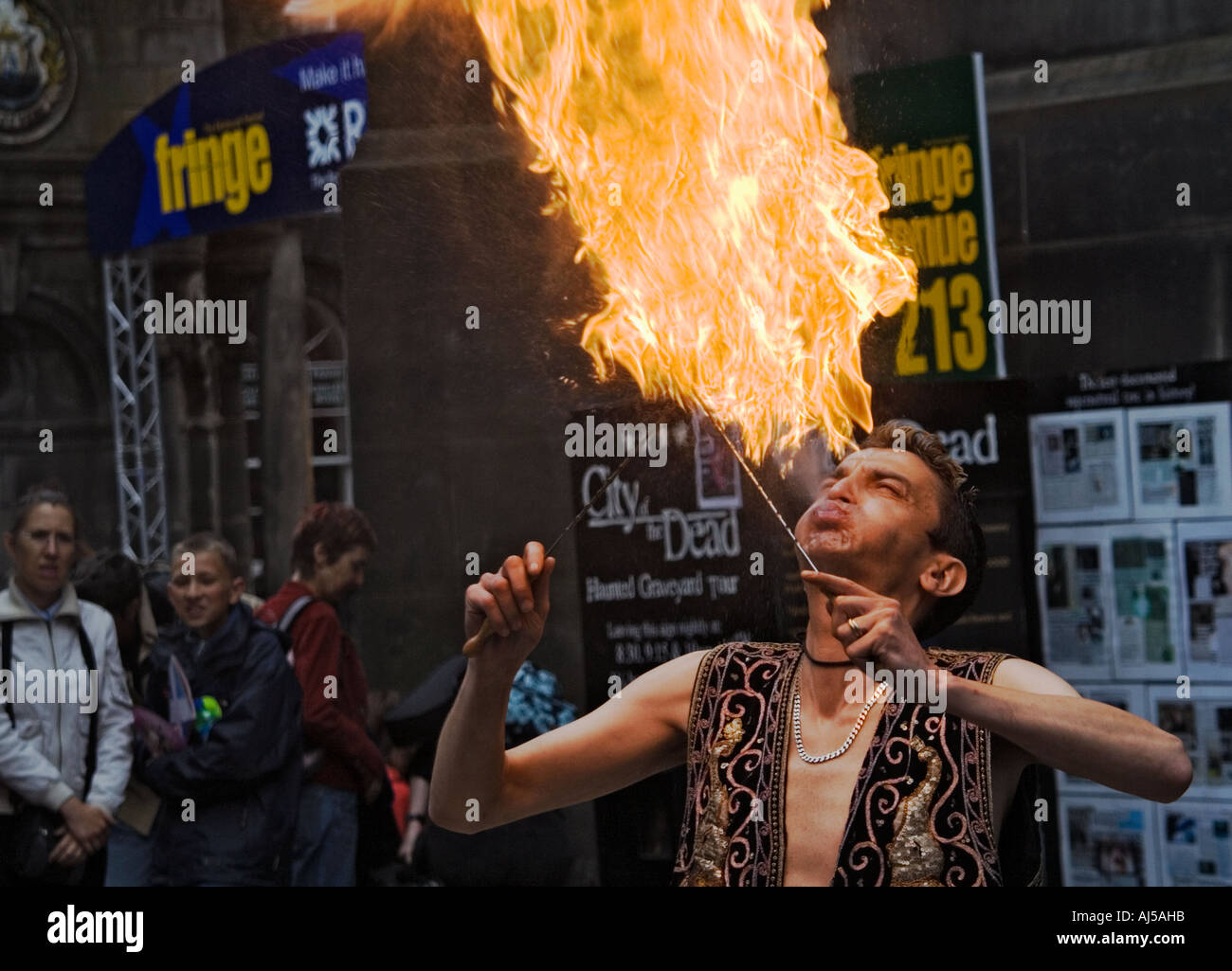 Torch burning fire performer blowing hi-res stock photography and ...