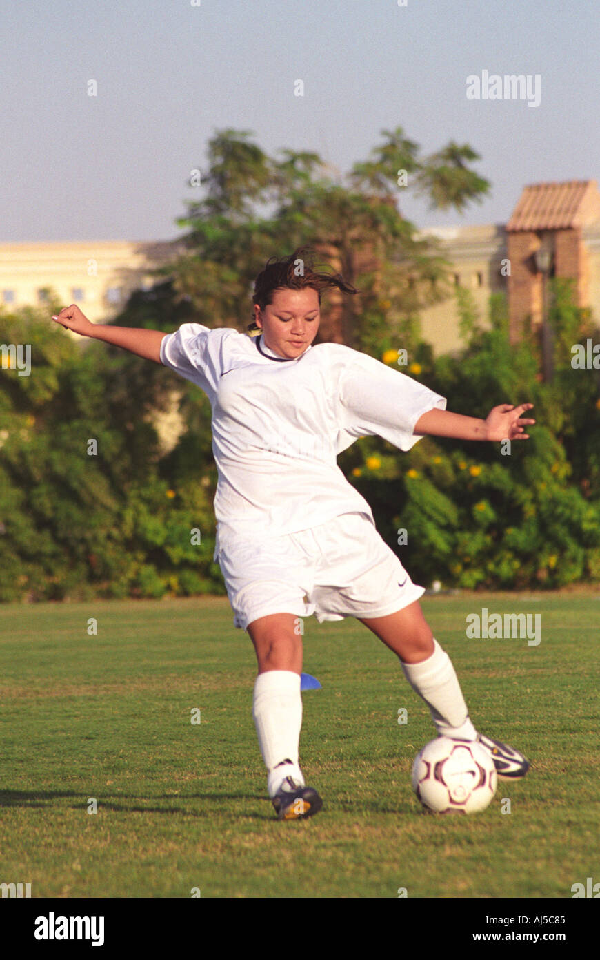 young girl playing football Stock Photo - Alamy