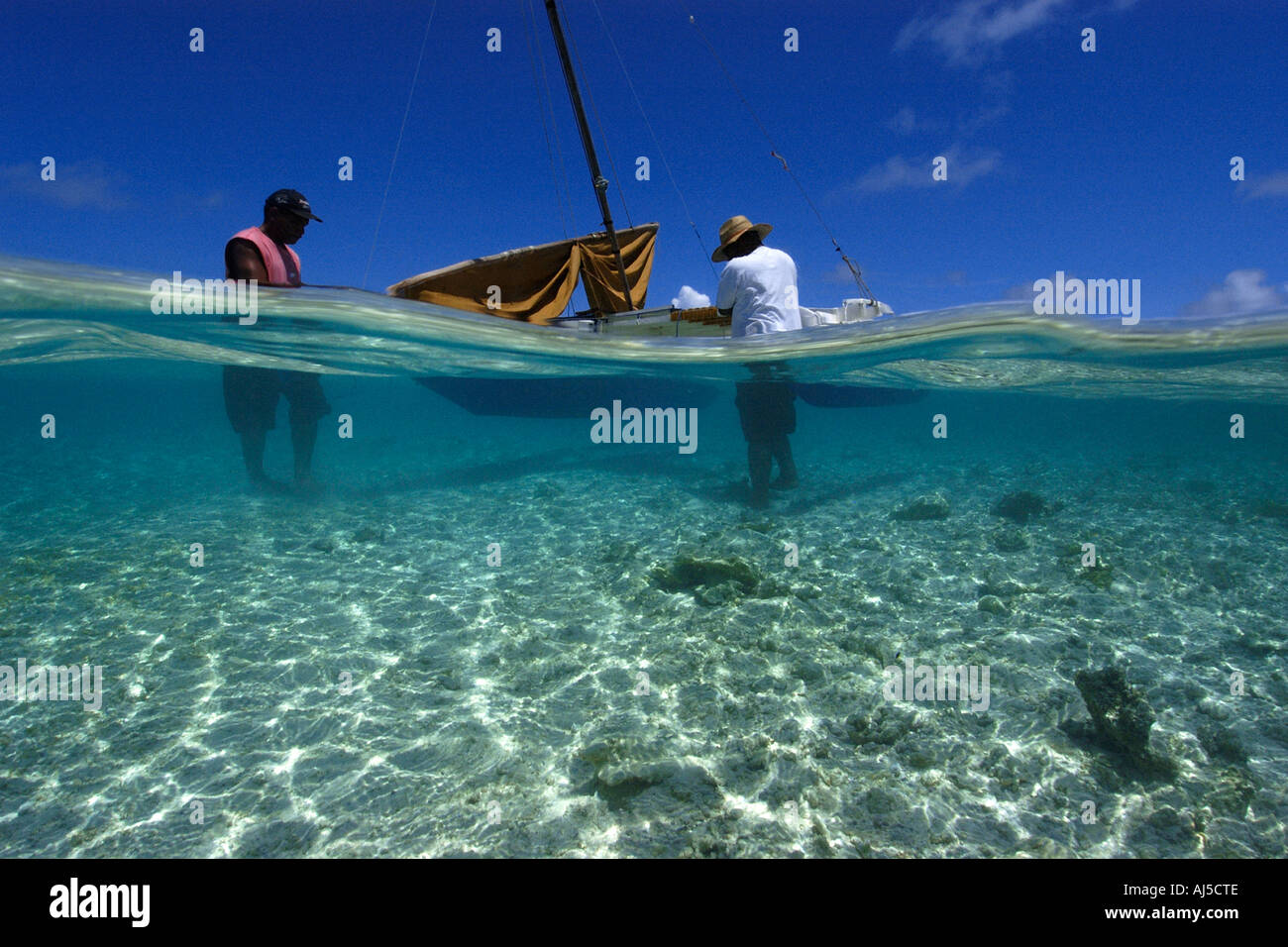 Men invert sail position on traditional outrigger canoe Ailuk atoll ...