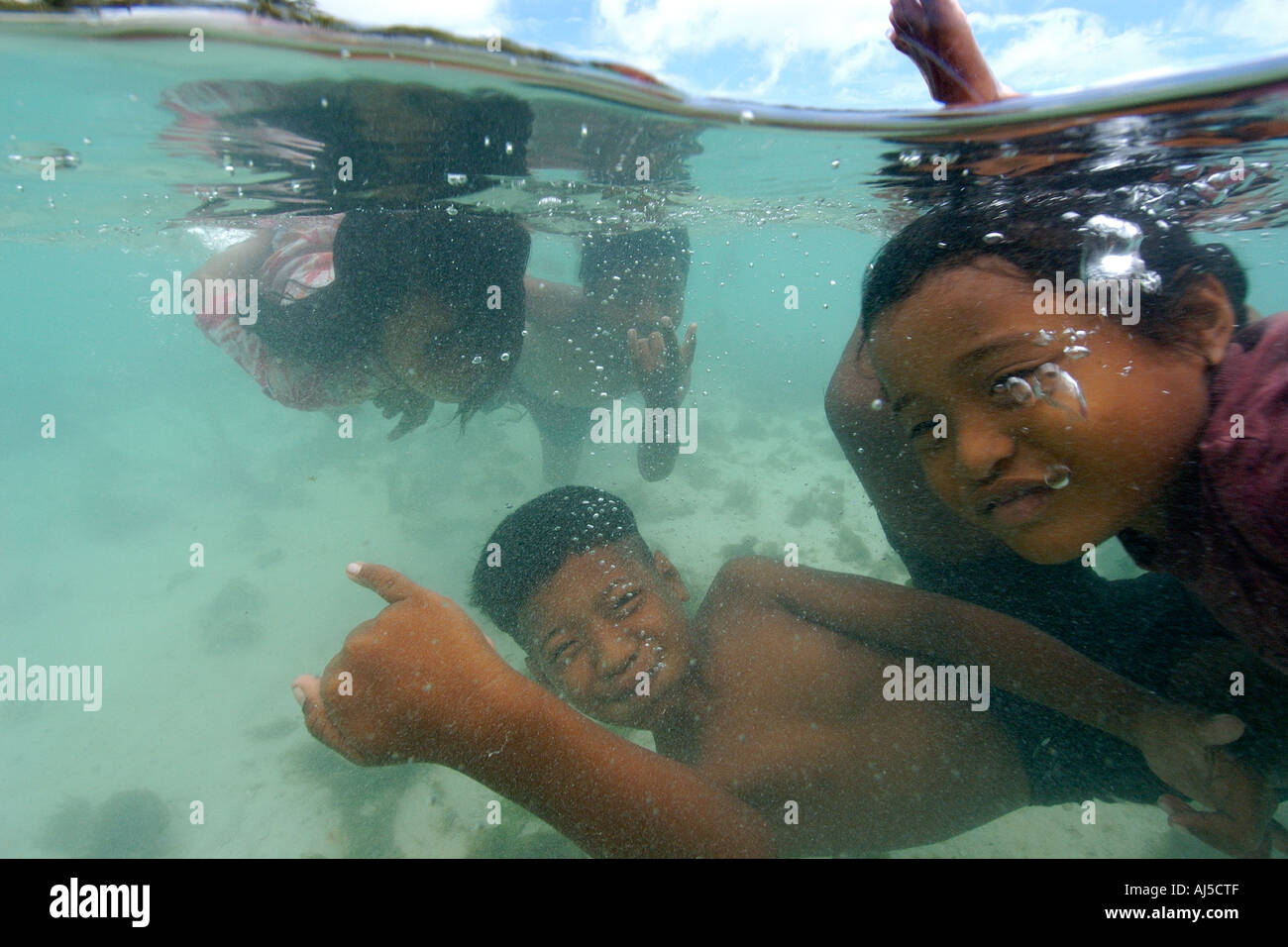 Marshalhese kids playing underwater Ailuk atoll Marshall Islands ...